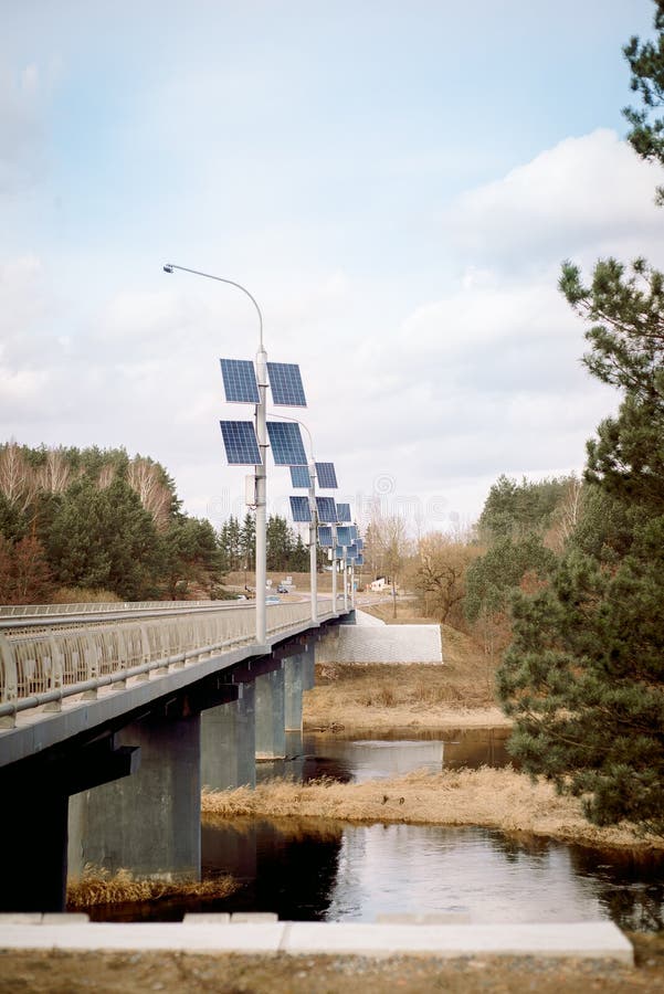 Solar Panels in the Forest. Bridge and River in Spring Stock Photo ...