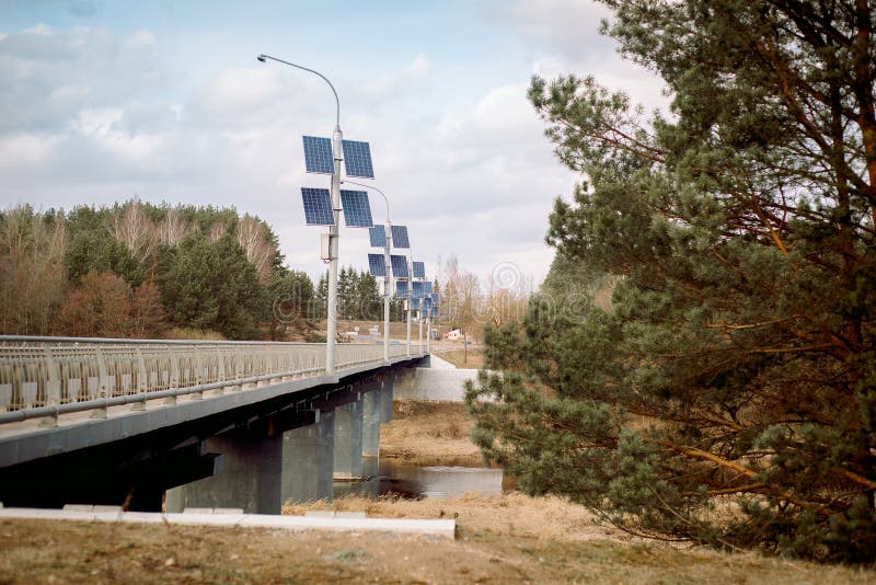 Solar Panels in the Forest. Bridge and River in Spring Stock Photo ...