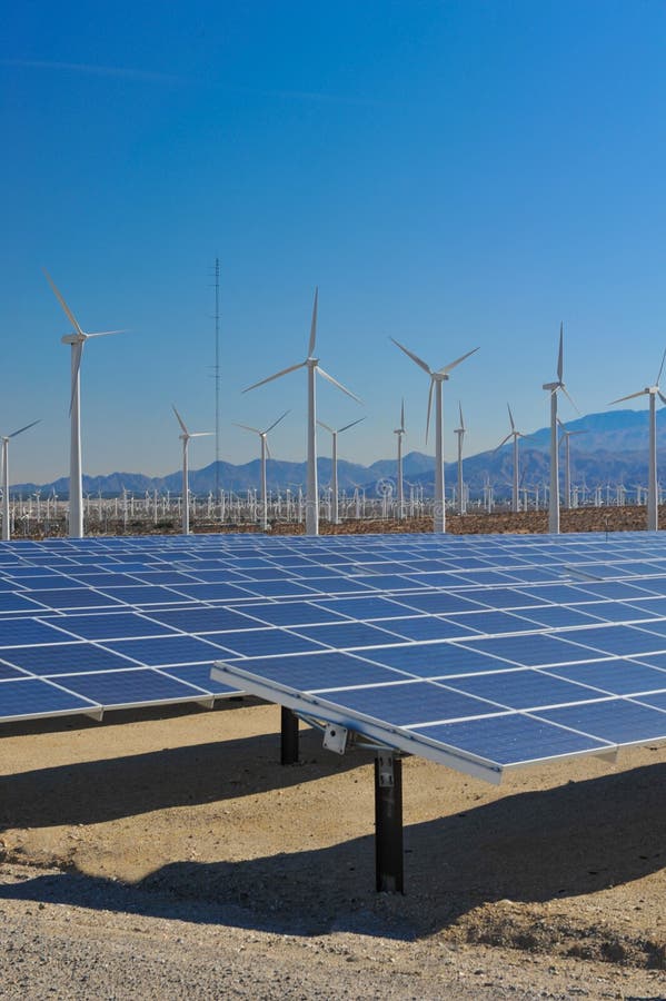 Solar Panels in Front of Wind Turbines and Mountians Stock Photo ...
