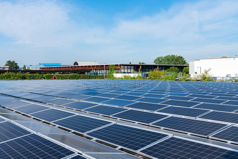 Solar Panels Installed on the Ground Under a Blue Sky with Light Clouds ...