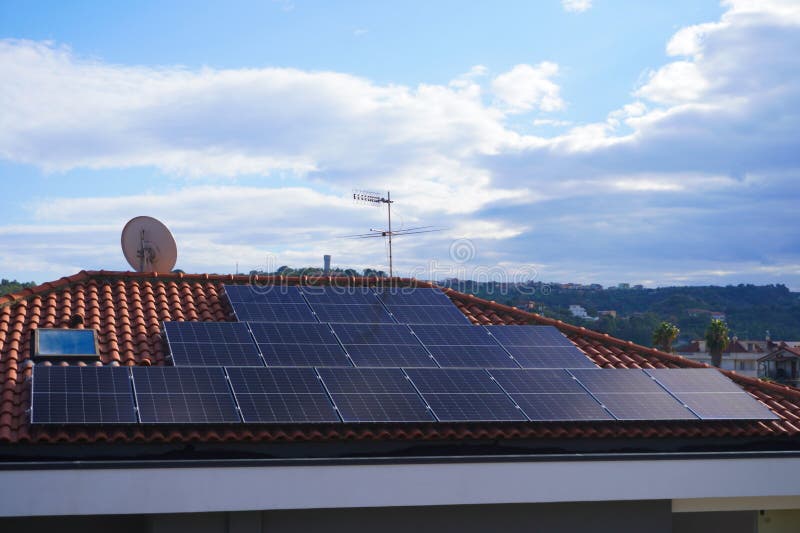 Solar Panels Installed on a Tiled Roof of a Private House Stock Photo ...