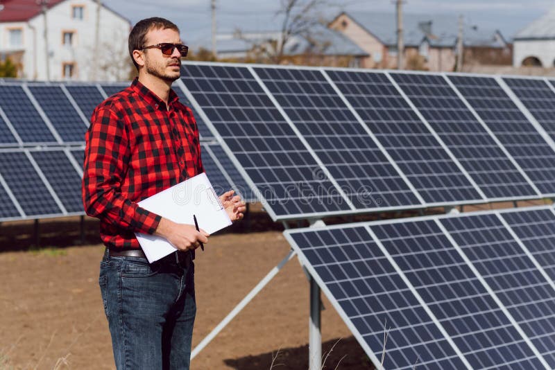 Solar Panels. Man Standing Near Solar Panels Stock Photo - Image of ...