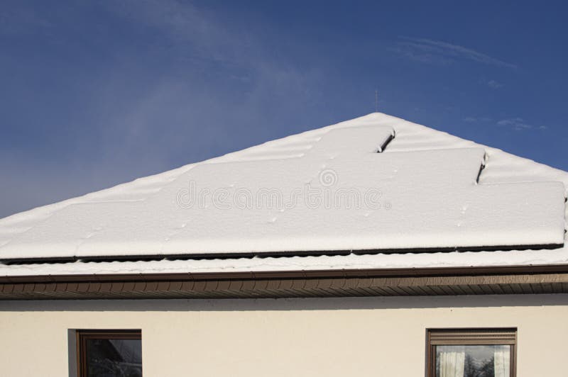 Solar Panels on a Private House Covered with Snow Stock Photo - Image ...