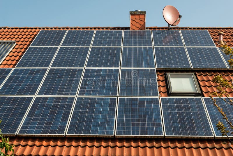 Solar panels on a red roof stock image. Image of equipment - 58256525