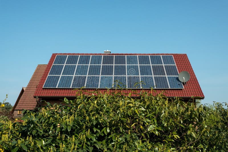 Solar panels on a red roof stock photo. Image of cells - 58257034
