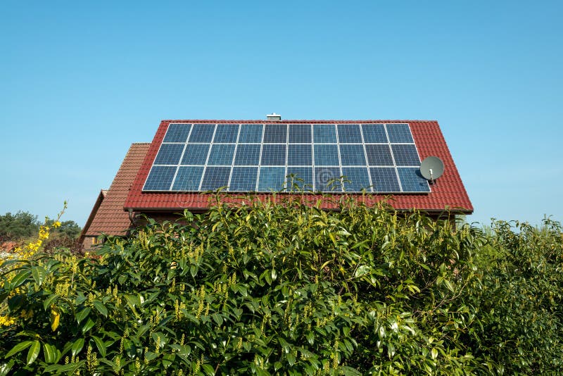 Solar panels on a red roof stock image. Image of renewable - 58257201