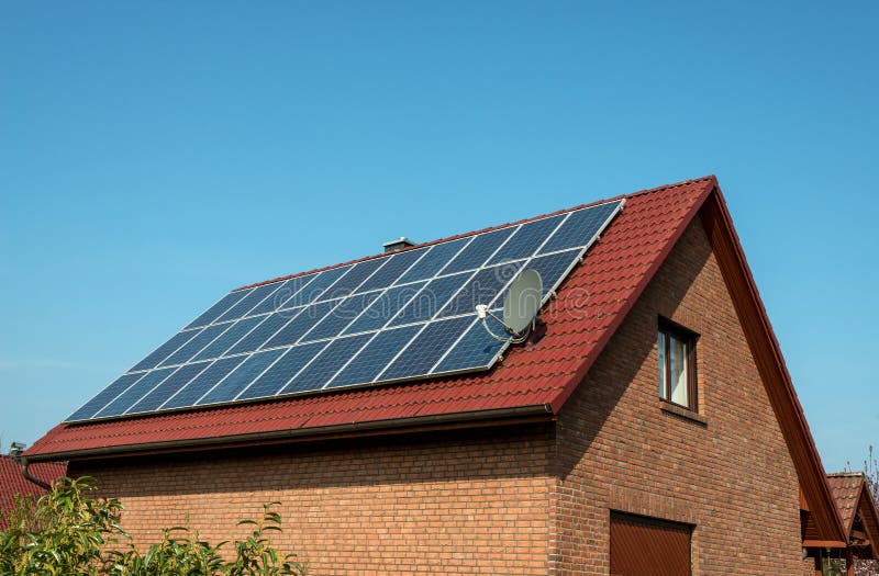 Solar panels on a red roof stock photo. Image of blue - 58257414
