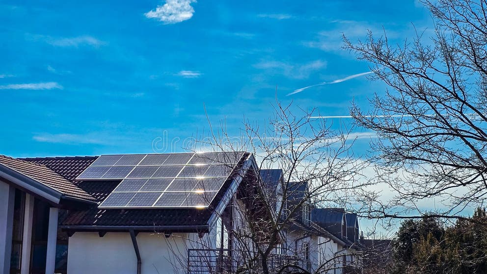 Solar Panels on the Roof of a Dwelling House. Sunlight is Reflected in ...