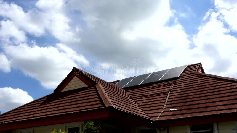 Solar Panels on the Roof of the House with Clouds and Sky in Natural ...