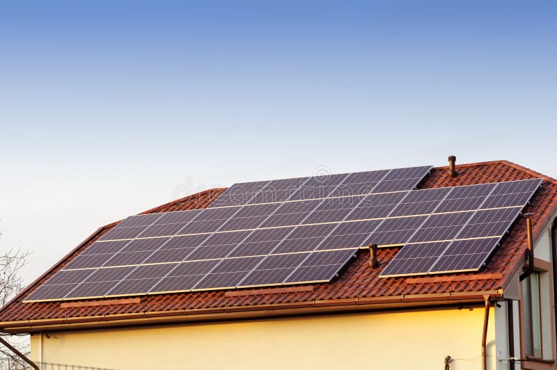 Solar Panels on the Roof of a Private House, Evening Time Stock Photo ...
