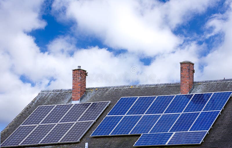Solar Panels on Roof Top with Blue Sky in Background. Stock Photo ...
