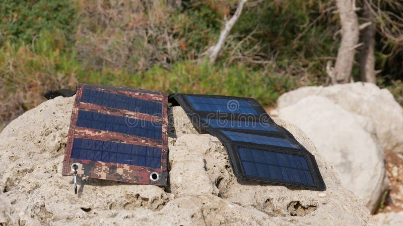 Solar Panels for Tourism Lie on a Rock Under the Sun. Stock Image ...