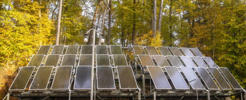 Solar Panels in Autumnal Forest Stock Image - Image of blue ...