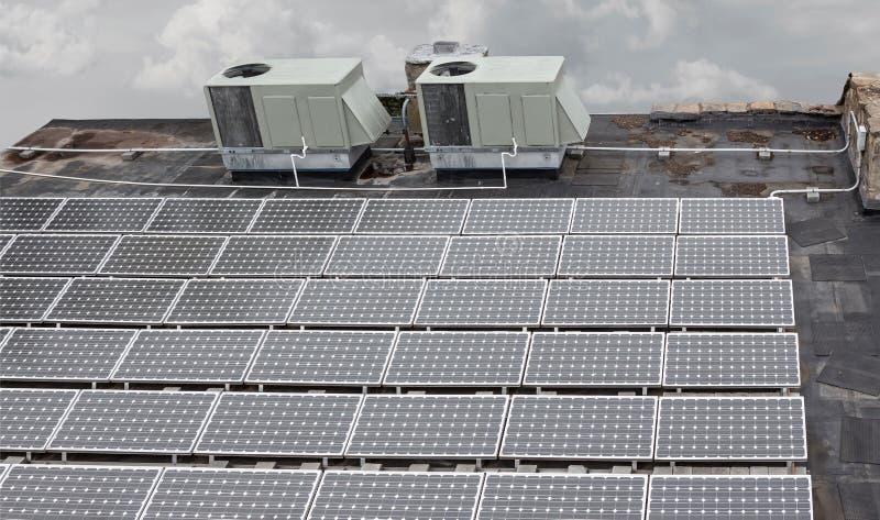 Solar Panels on a Tall Roof of a Building. Stock Image - Image of roof ...