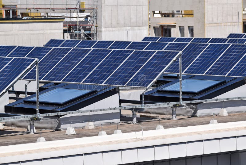 Solar Panels on the Top of a Building Stock Photo - Image of roof, city ...