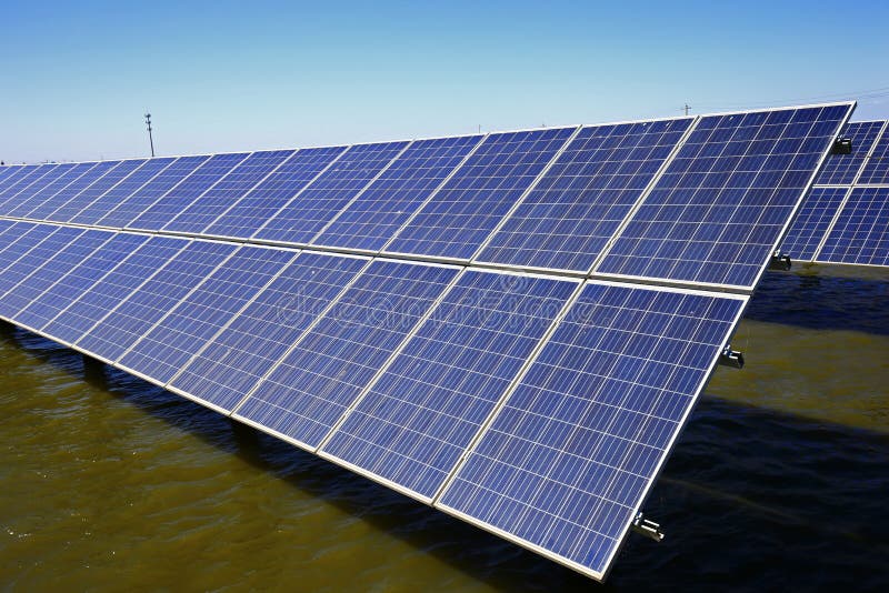 Solar panels on the water stock photo. Image of green - 216747388
