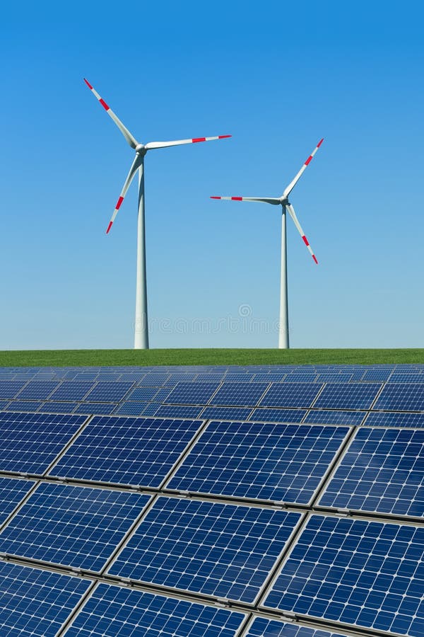 Wind Turbines and Solar Panels in a Rapeseed Field Stock Image - Image ...