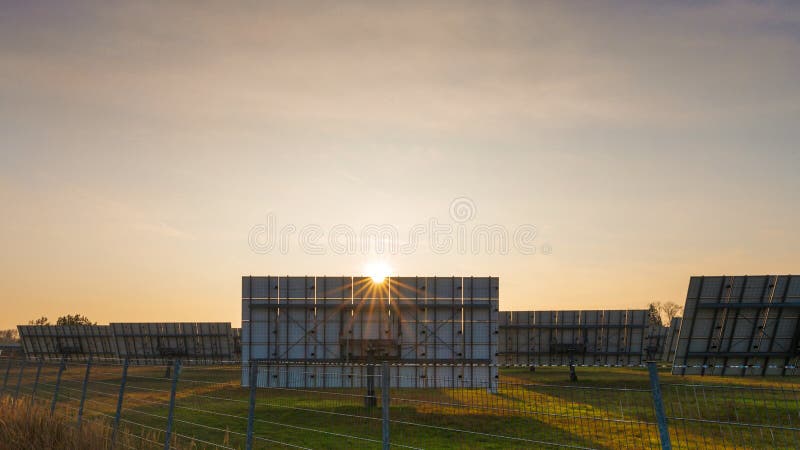 A solar park at sunset stock image. Image of power, environment - 164851745