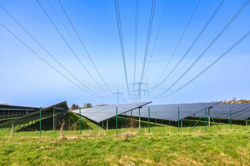 Solar park with pylon stock photo. Image of production - 314151936