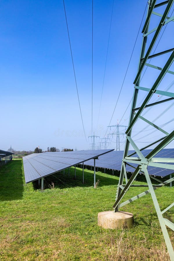 Solar park with pylon stock photo. Image of production - 314152000