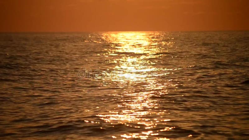 The Solar Path Glows on the Wavy Surface of the Sea Water. Golden ...