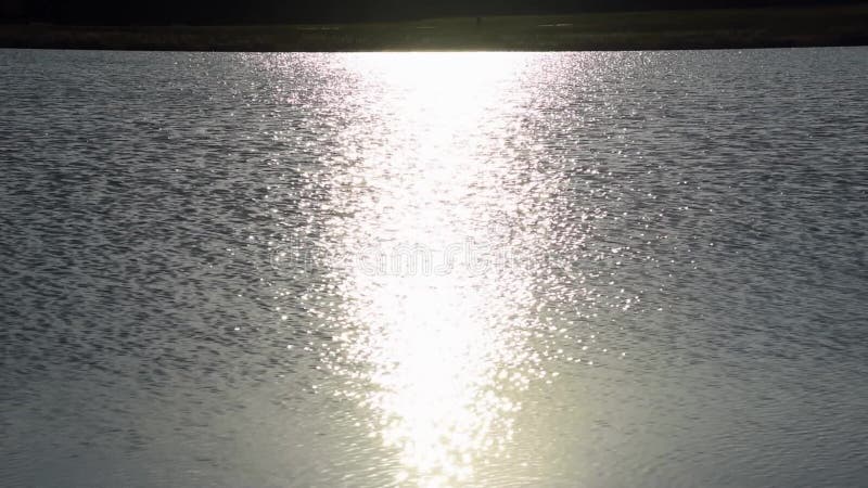 The Solar Path Glows on the Wavy Surface of the Sea Water. Golden ...