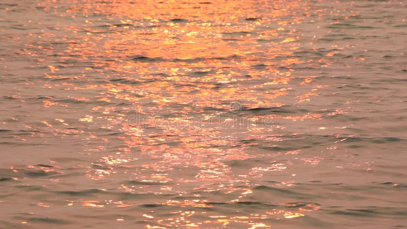 The Solar Path Glows on the Wavy Surface of the Sea Water. Golden ...