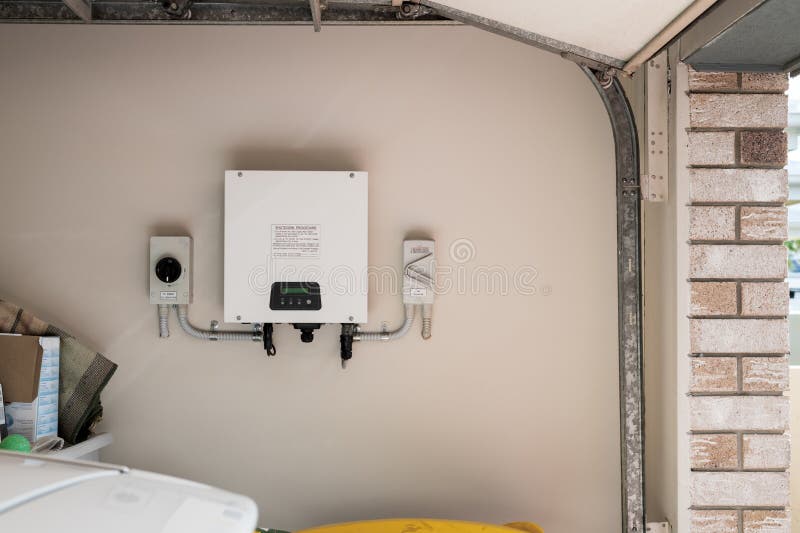 Solar Power Inverter Mounted Inside Garage of a House Stock Photo ...