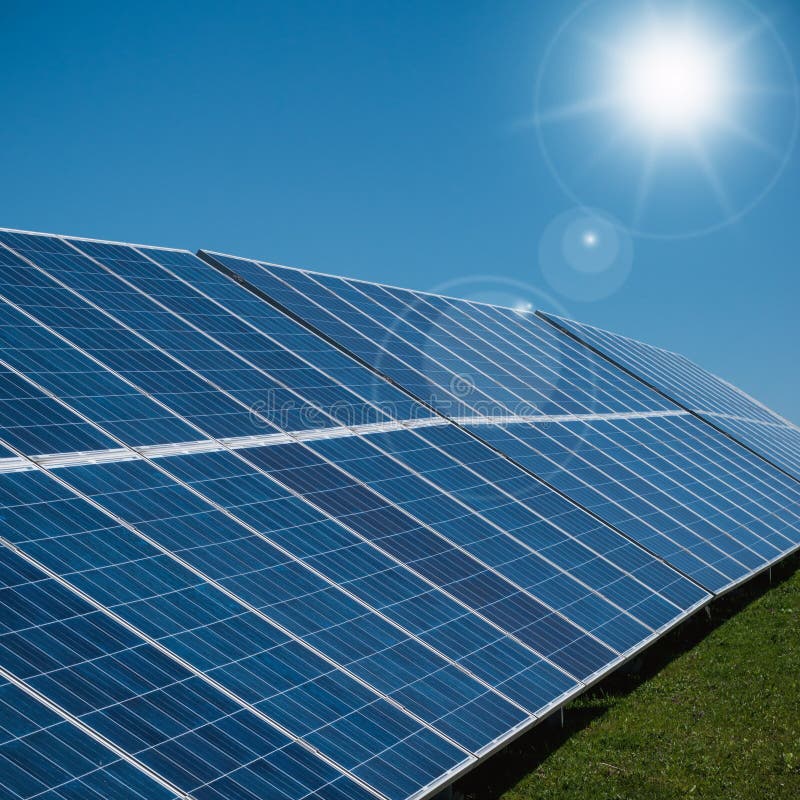 Solar Power Plant Panels with Sun Rays and Blue Sky Stock Photo - Image ...