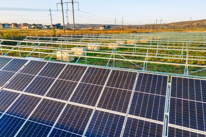 Solar Power Plant Under Construction on Green Field. Assembling of ...