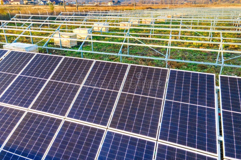 Solar Power Plant Under Construction on Green Field. Assembling of ...