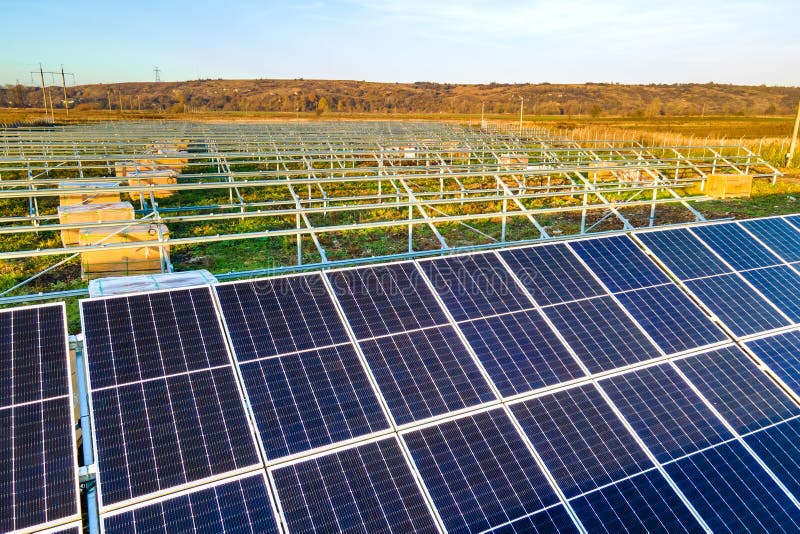 Solar Power Plant Under Construction on Green Field. Assembling of ...