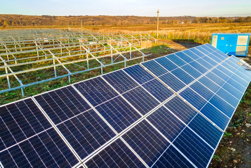 Solar Power Plant Under Construction on Green Field. Assembling of ...