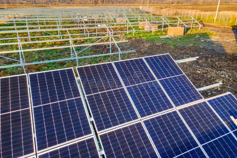 Solar Power Plant Under Construction on Green Field. Assembling of ...