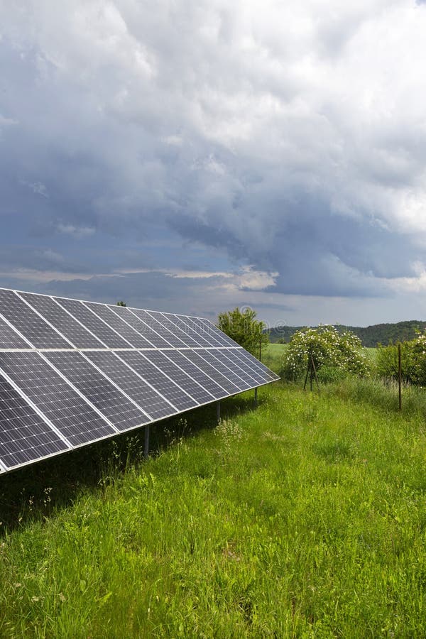 Solar Power Station on the Spring Flowering Meadow Stock Photo - Image ...