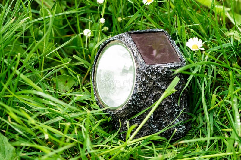 Solar Powered Garden Lamp on Green Grass. Ecological Energy, Garden ...