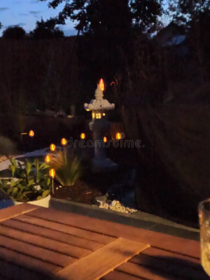 Solar Powered Garden Lights. Cozy Terrace at Night. Stock Photo - Image ...