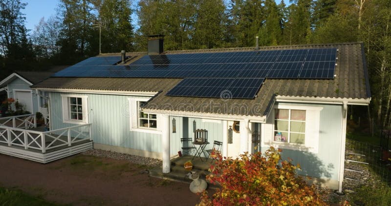 A Solar Powered House with Small Colorful Tree in the Front Yard and ...