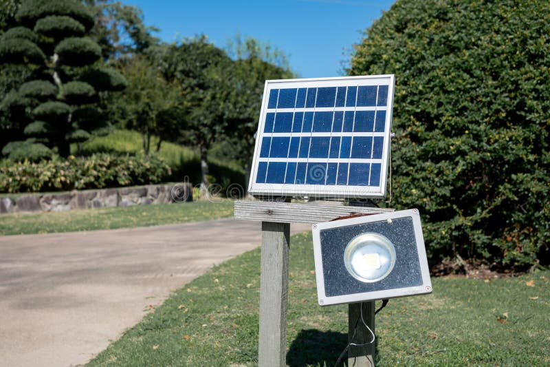 A Solar-powered LED Light on the Sidewalk. Stock Photo - Image of ...