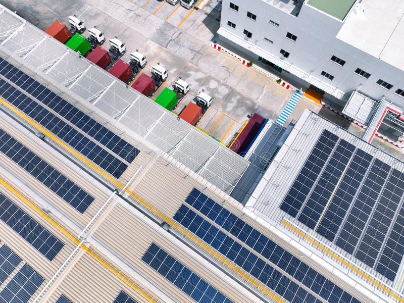 Solar-powered Warehouse Facility with Freight Trucks at Loading Docks ...