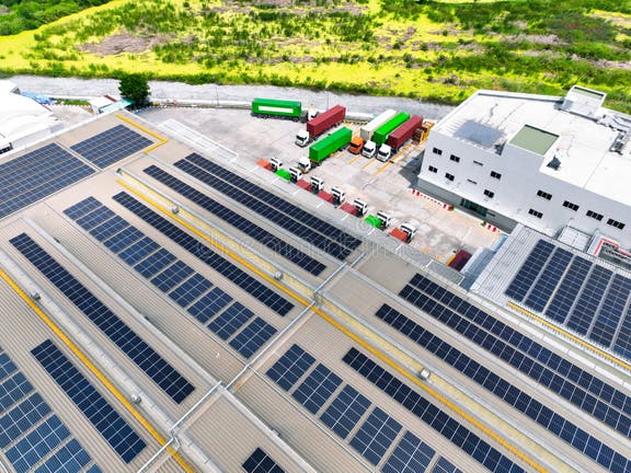 Solar-powered Warehouse Facility with Freight Trucks at Loading Docks ...