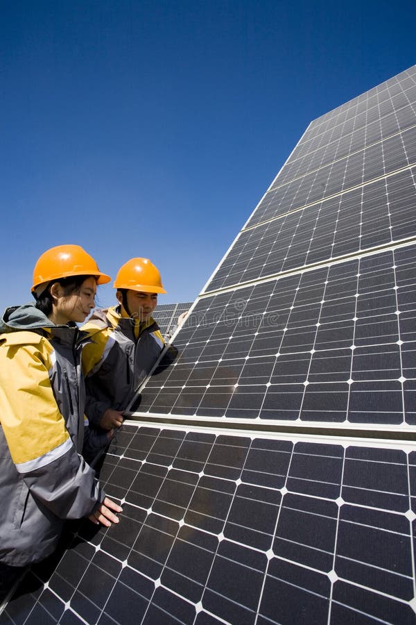 Adjusting Solar Panels 2 stock photo. Image of alternative - 18731010