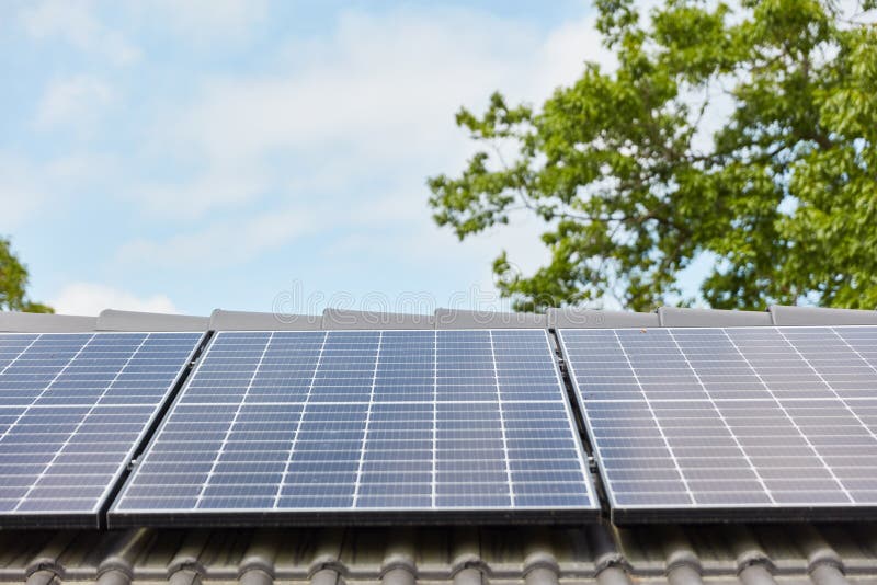 Solar System on House Roof in Front of Sky and Tree Stock Image - Image ...