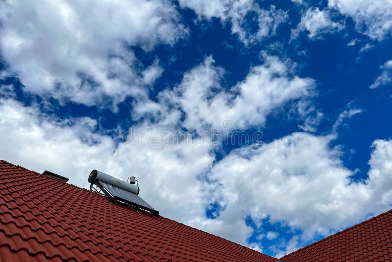 Solar Water Heater Boiler on Rooftop, Beautiful Blue Sky Stock Photo ...