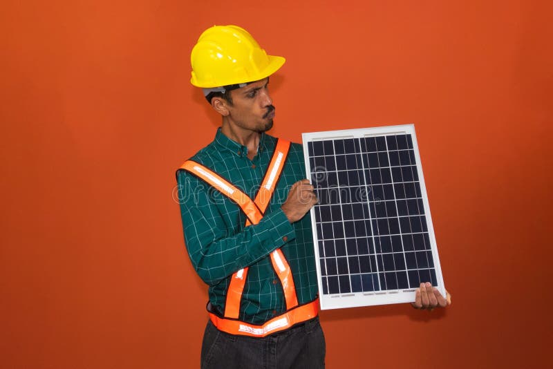 Solar Worker in Protective Work Clothes Holding Photovoltaic Panel ...