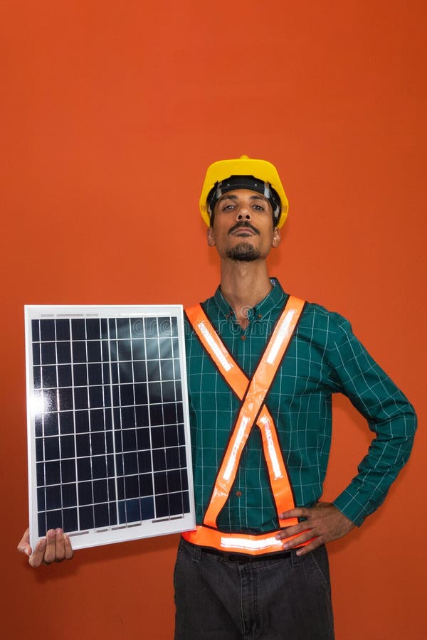 Solar Worker in Protective Work Clothes Holding Photovoltaic Panel ...