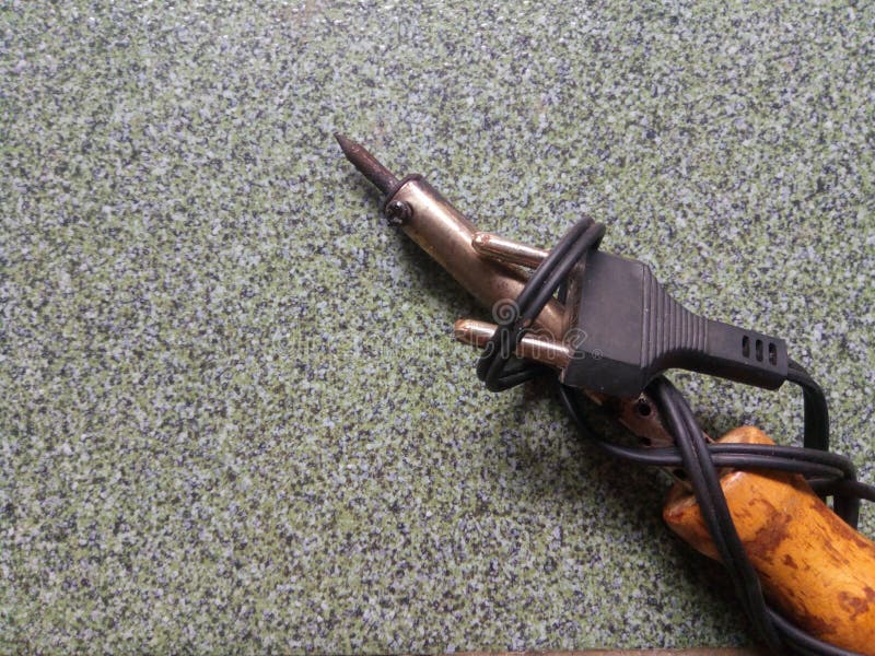 Solder on the tile floor stock image. Image of trigger - 247825221