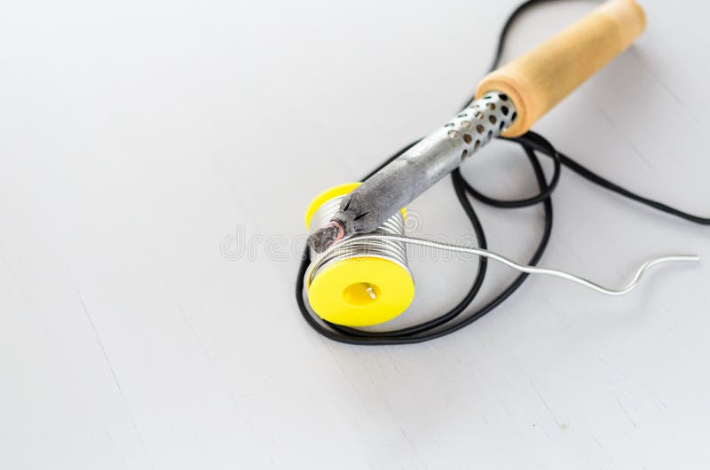 Solder Wire and Soldering Iron with Wooden Handle on Gray Background ...