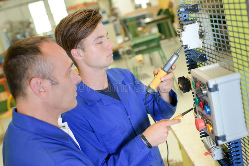 Solderer Apprentice and Teacher Stock Photo - Image of degrees, melt ...