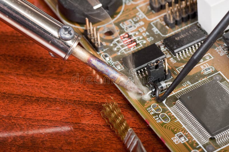 Soldering a computer board stock photo. Image of technology - 9808854